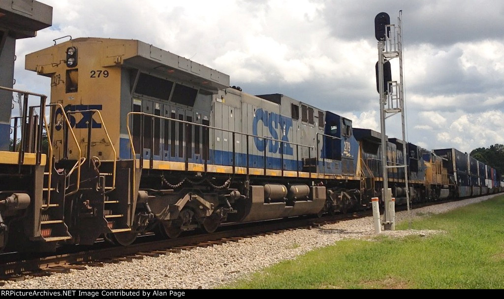CSX AC44CW 244 leads sister-unit 279, C40-8W 7926, and UP SD70M 4294 past the signals